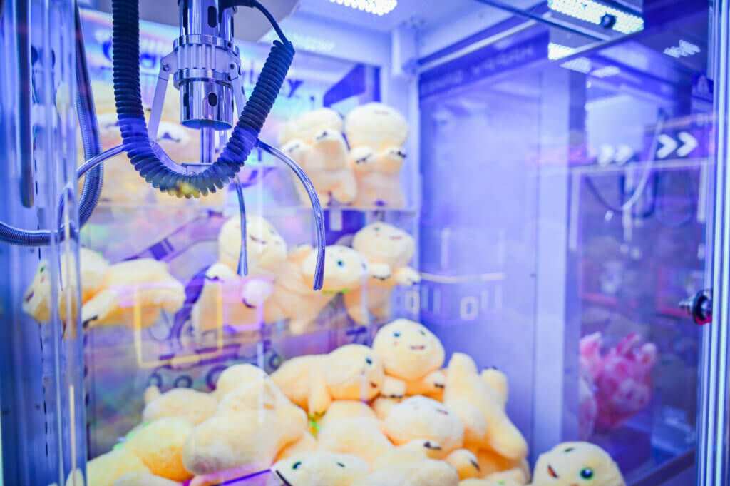 Get drawn in by the soft glow of Claw Galaxy arcade - Shop The Rock