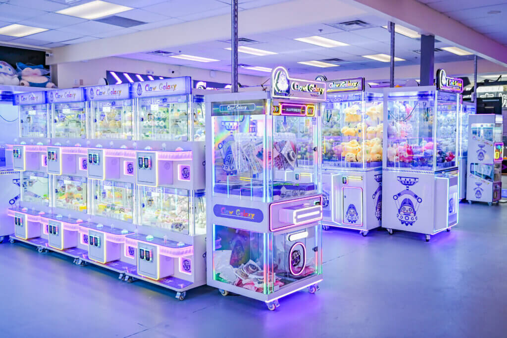 Get drawn in by the soft glow of Claw Galaxy arcade - Shop The Rock